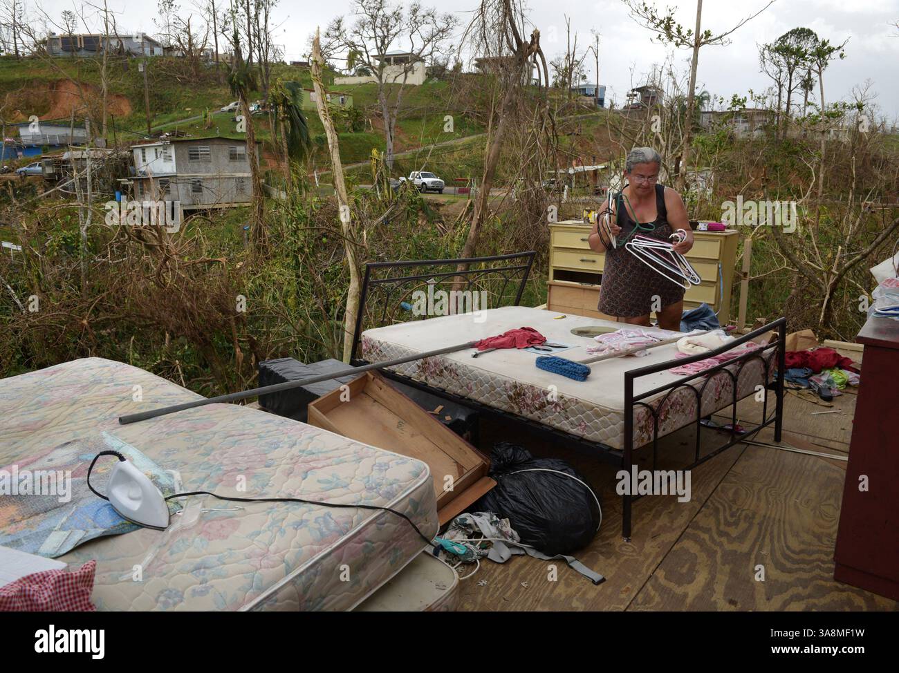 September 27, 2017 - Corozal, Puerto Rico - YOLANDA NEGRON cleans up ...