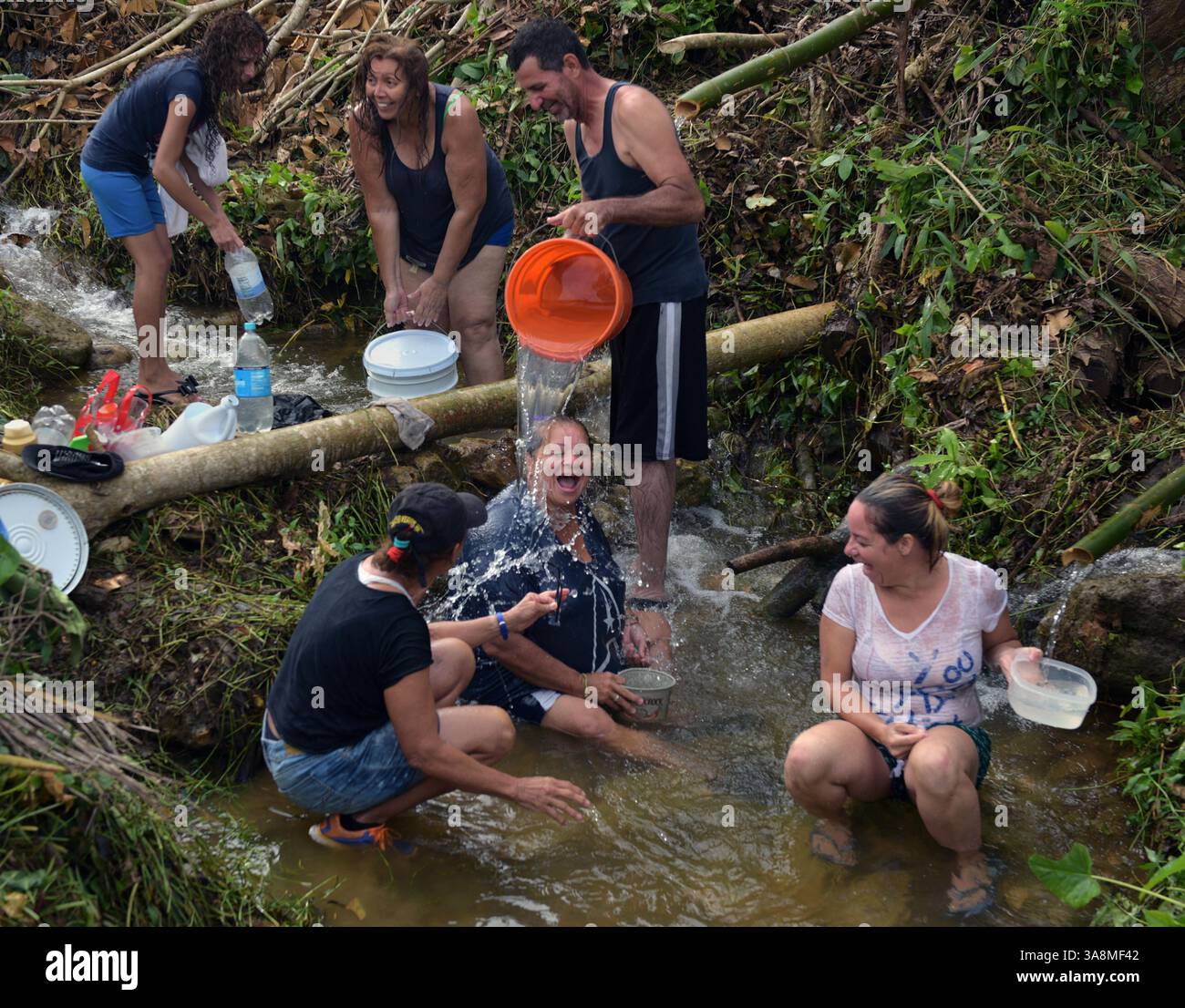 September 27, 2017 - Corozal, Puerto Rico - Residents wash in spring ...
