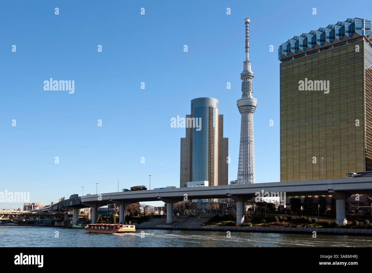 Tokyo Skytree, the radio and TV broadcasting tower, rising high above ...
