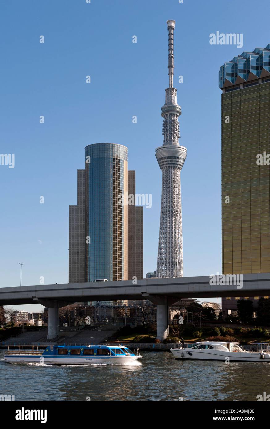 Tokyo Skytree, the radio and TV broadcasting tower, rising high above ...