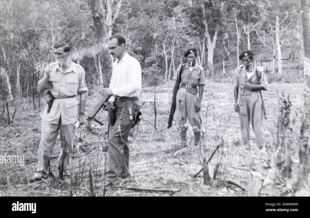 Armed British civilians alongside soldiers of the Malay Regiment during ...