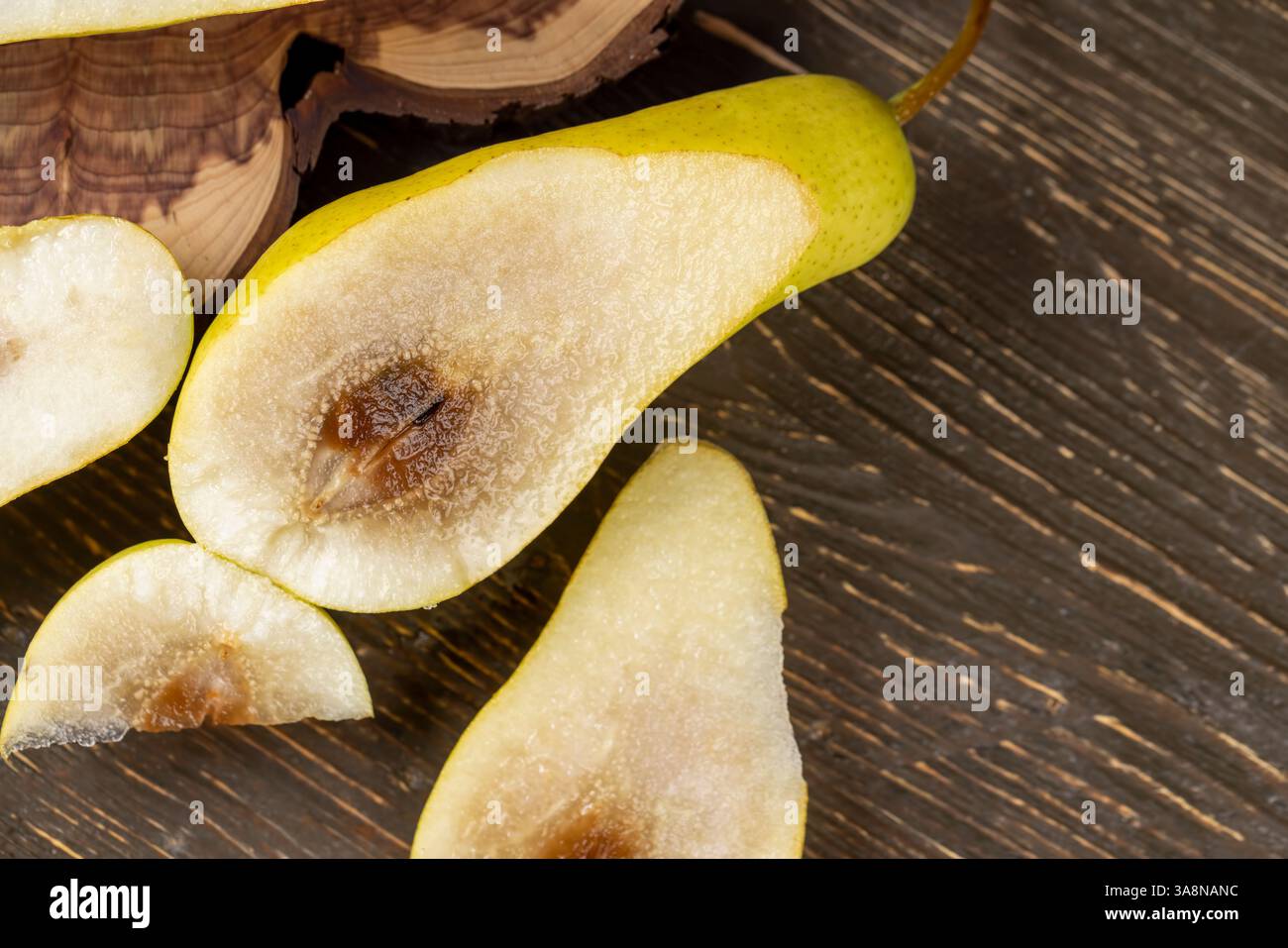 the pulp of pear inside of which has begun to rot, rotted inside of a ...
