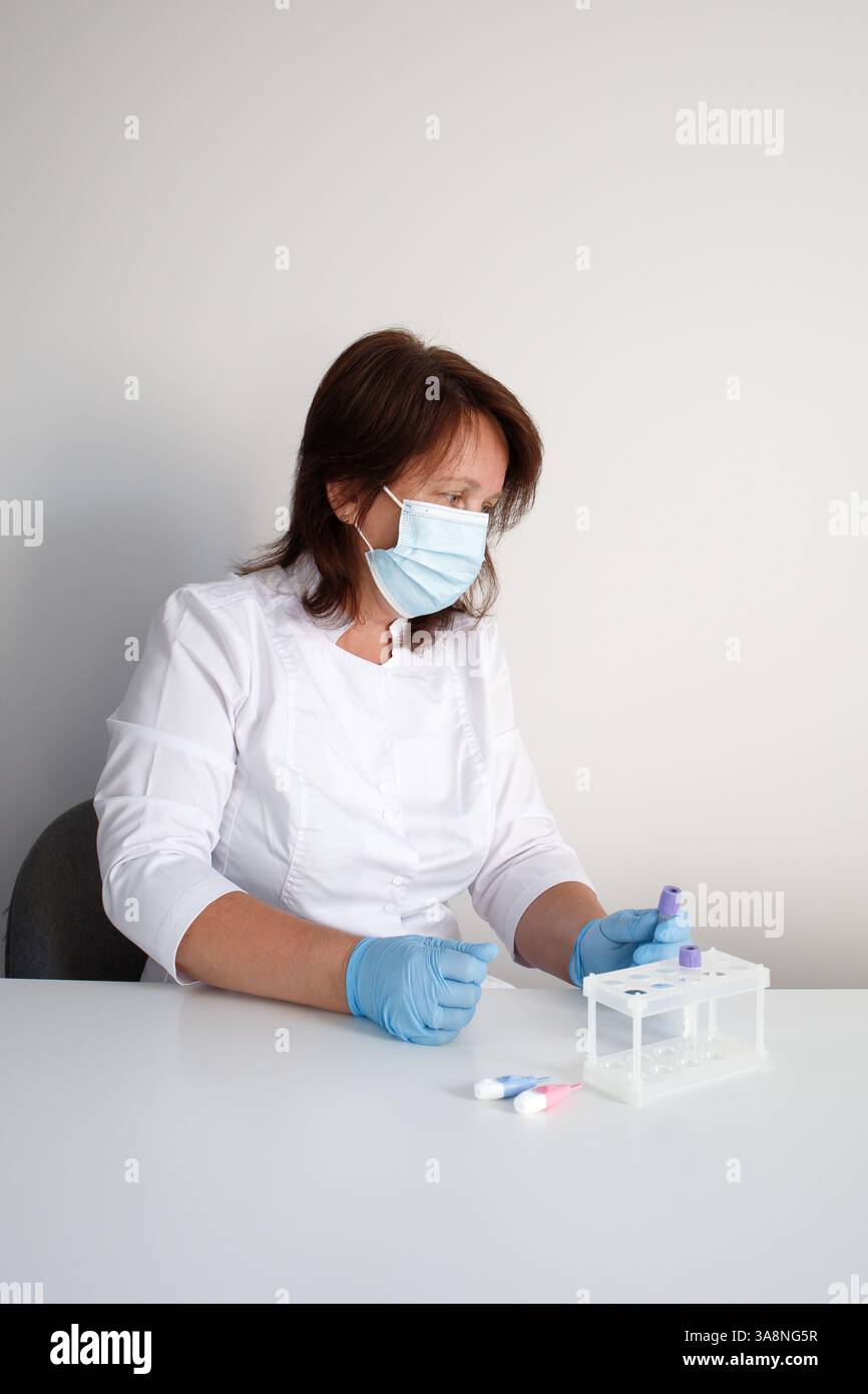 Medical laboratory nurse preparing workplace for making children blood ...