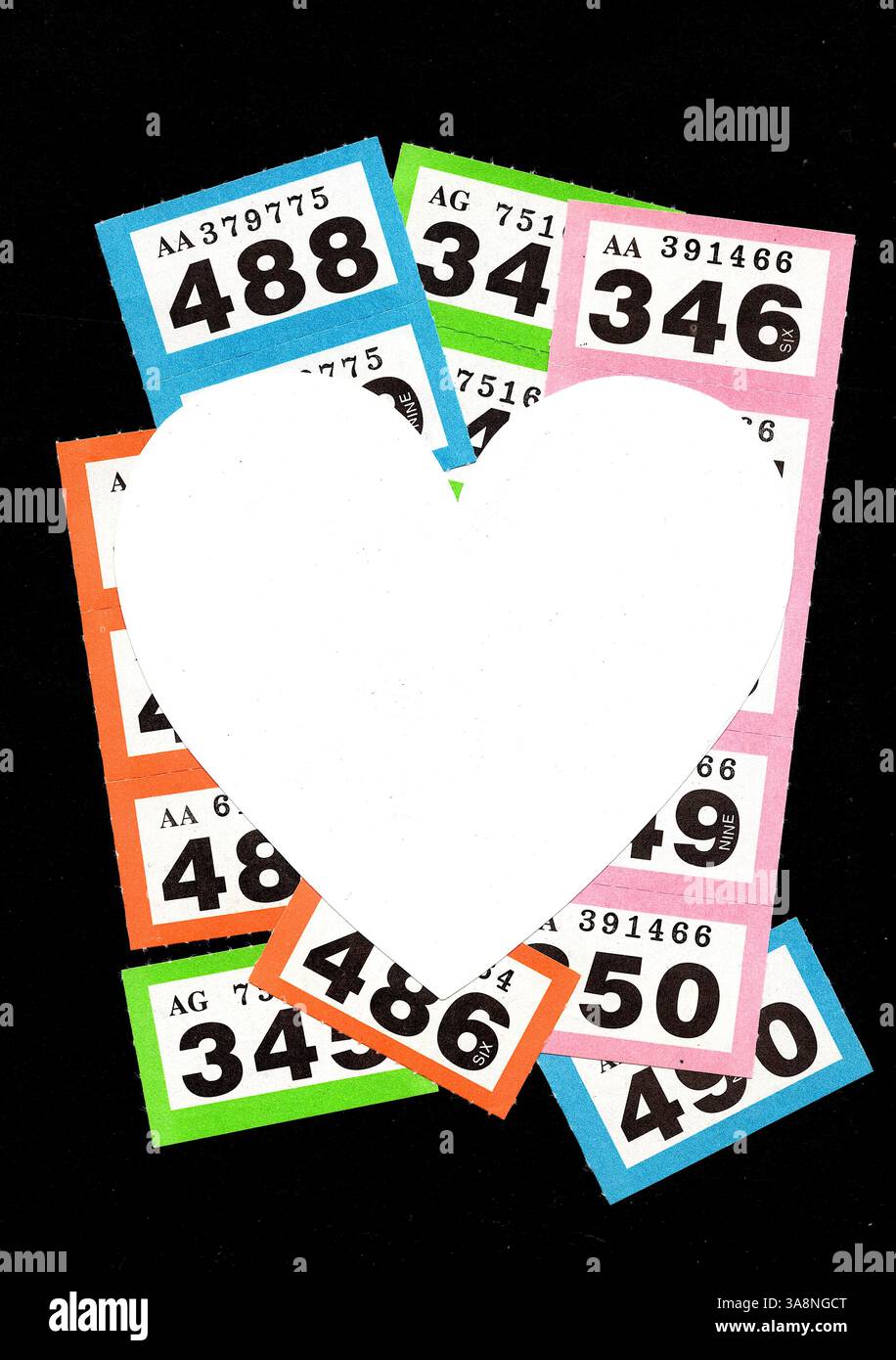 Vintage raffle tickets forming the shape of a heart on a black ...
