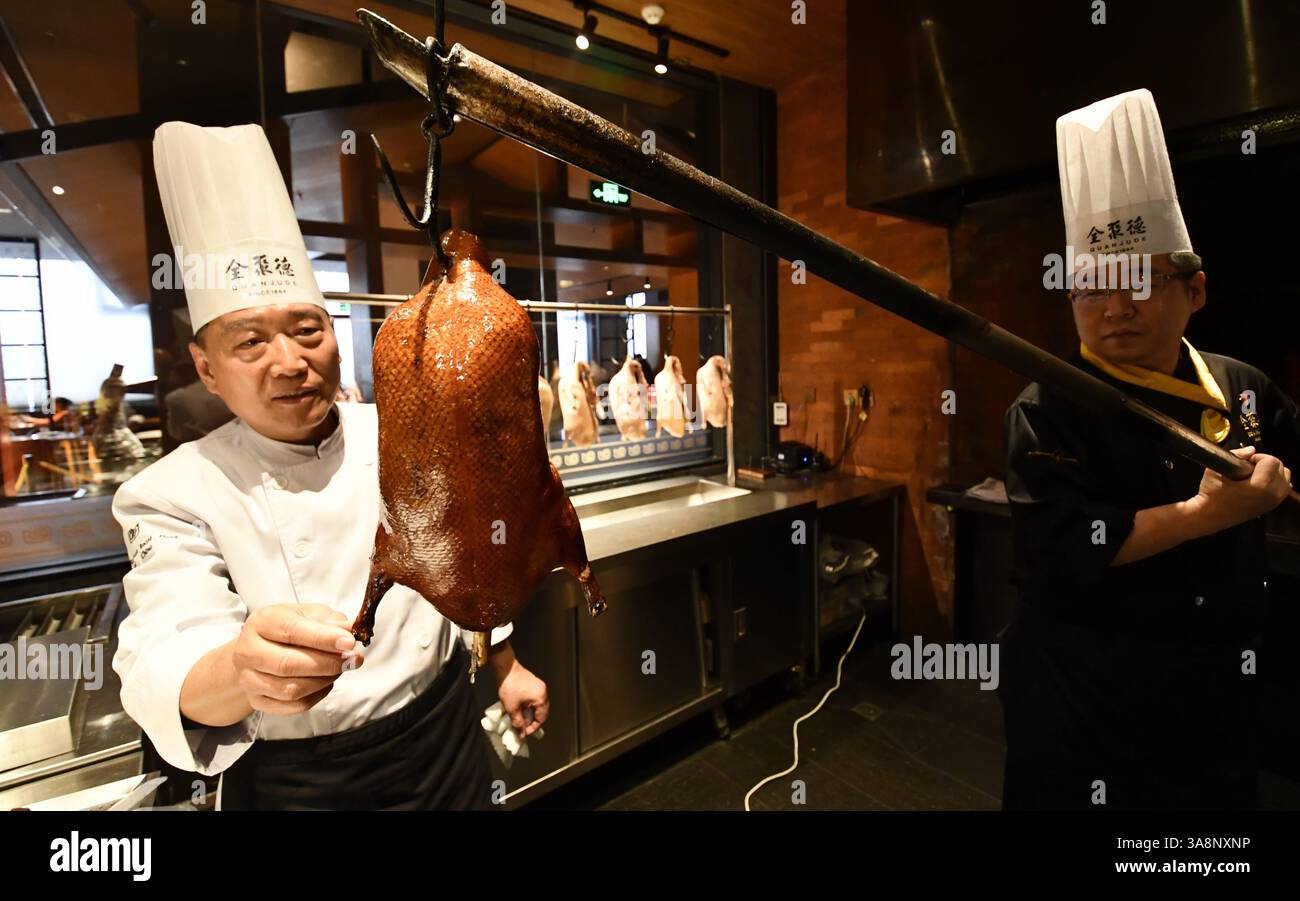 (250329) -- BEIJING, March 29, 2025 (Xinhua) -- Wu Yubo checks a ...