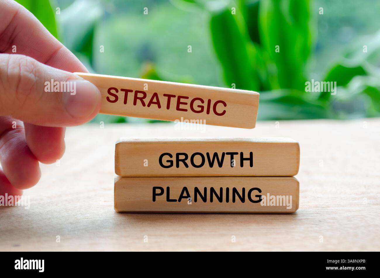 Hand putting Growth Planning text on wooden block. Business strategy and growth concept Stock ...
