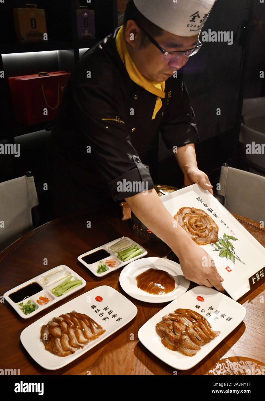 (250329) -- BEIJING, March 29, 2025 (Xinhua) -- A chef learns the dish ...