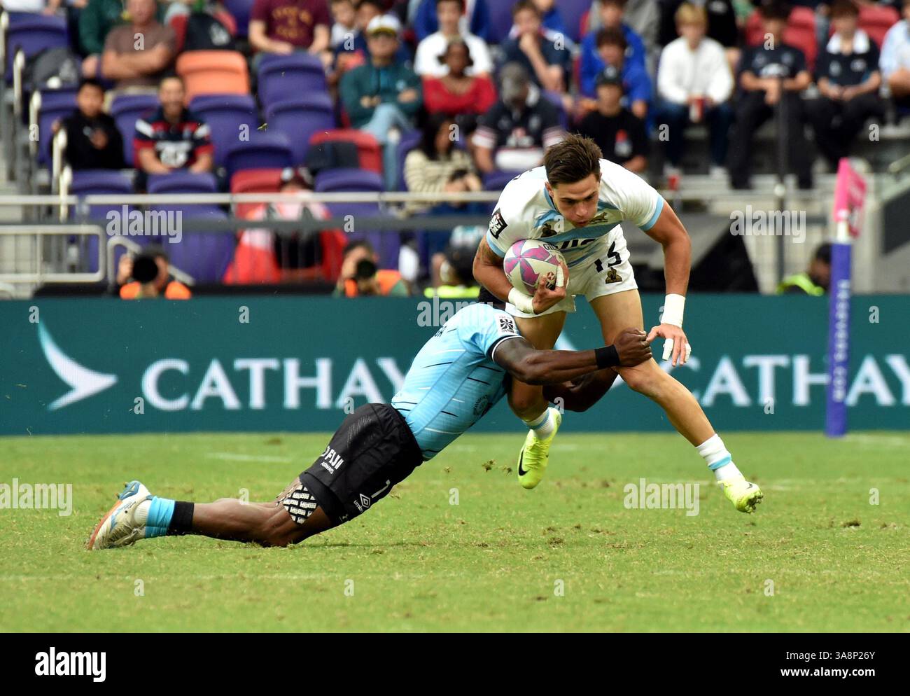 Hong Kong. 29th Mar, 2025. Argentina's Marcos Moneta (R) breaks through ...