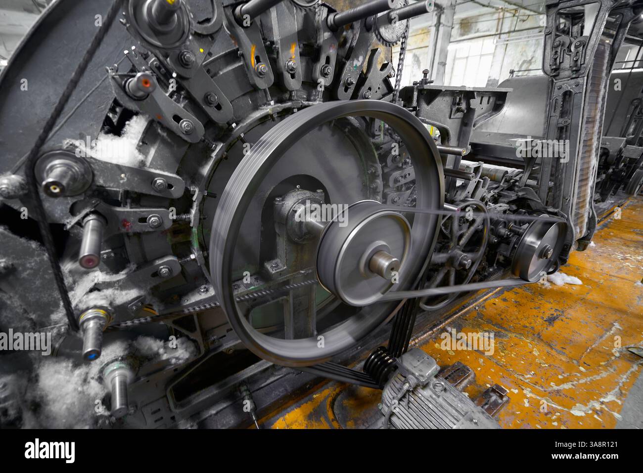 Exploring the intricate mechanics of a vintage carding machine in an ...