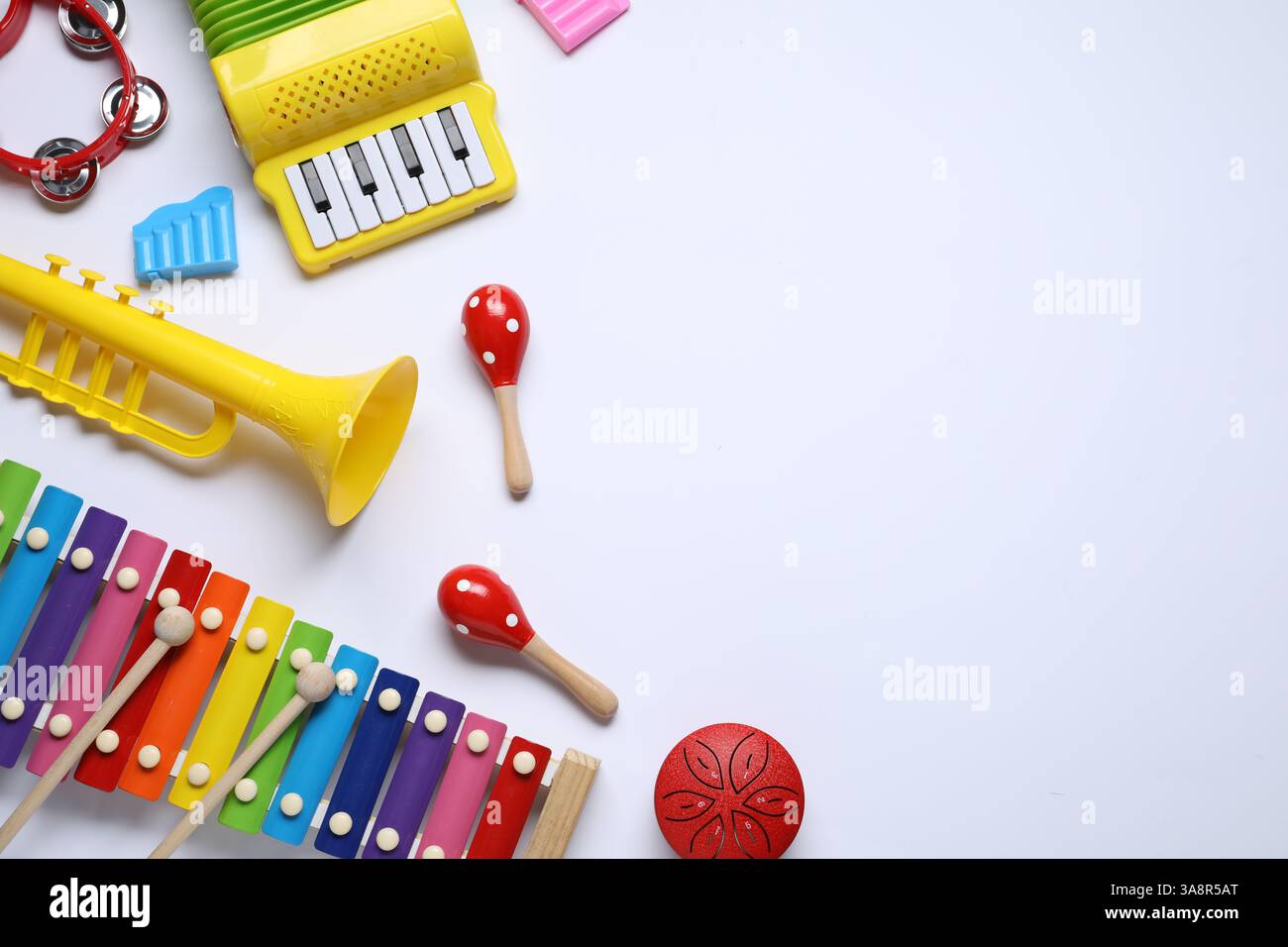 Flat lay composition with different toy musical instruments on white ...