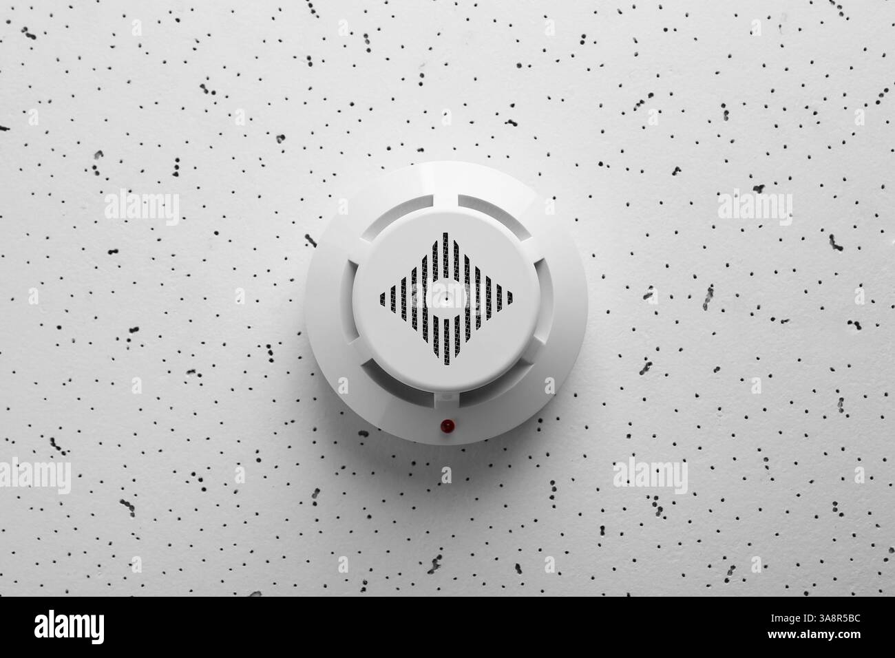 Smoke detector on light textured background, top view. Alarm system ...