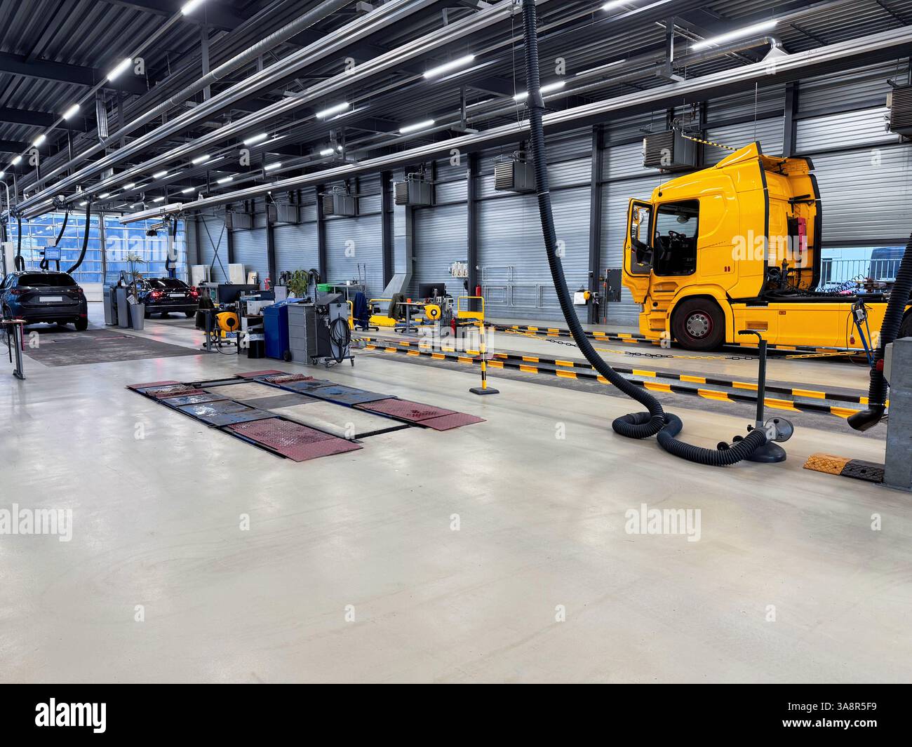Different cars undergoing procedure of vehicle inspection at station ...