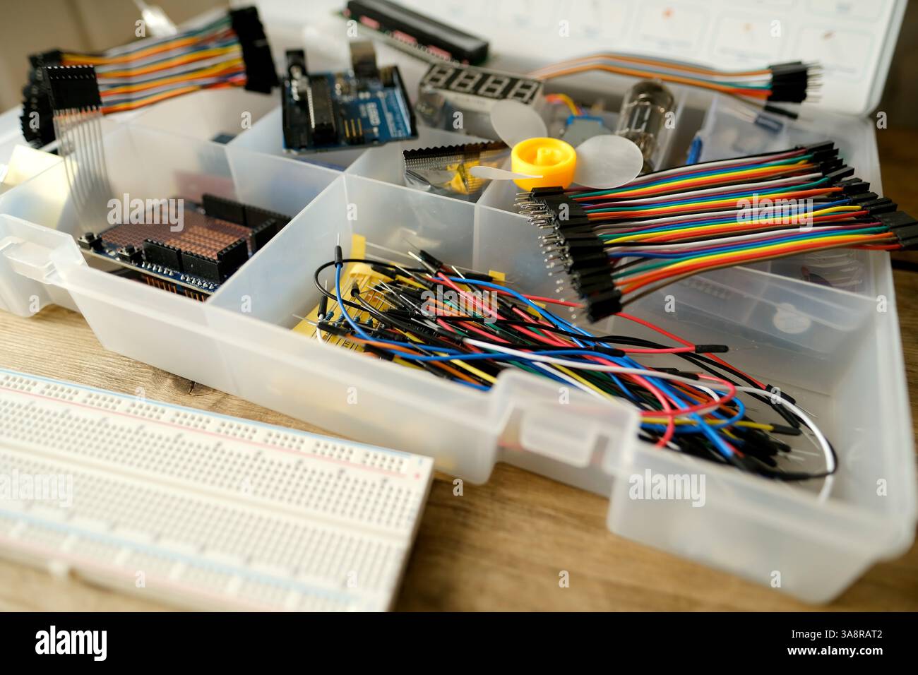 Electronics components, Breadboard in box with jumper wires and breadboard, symbolizing DIY ...