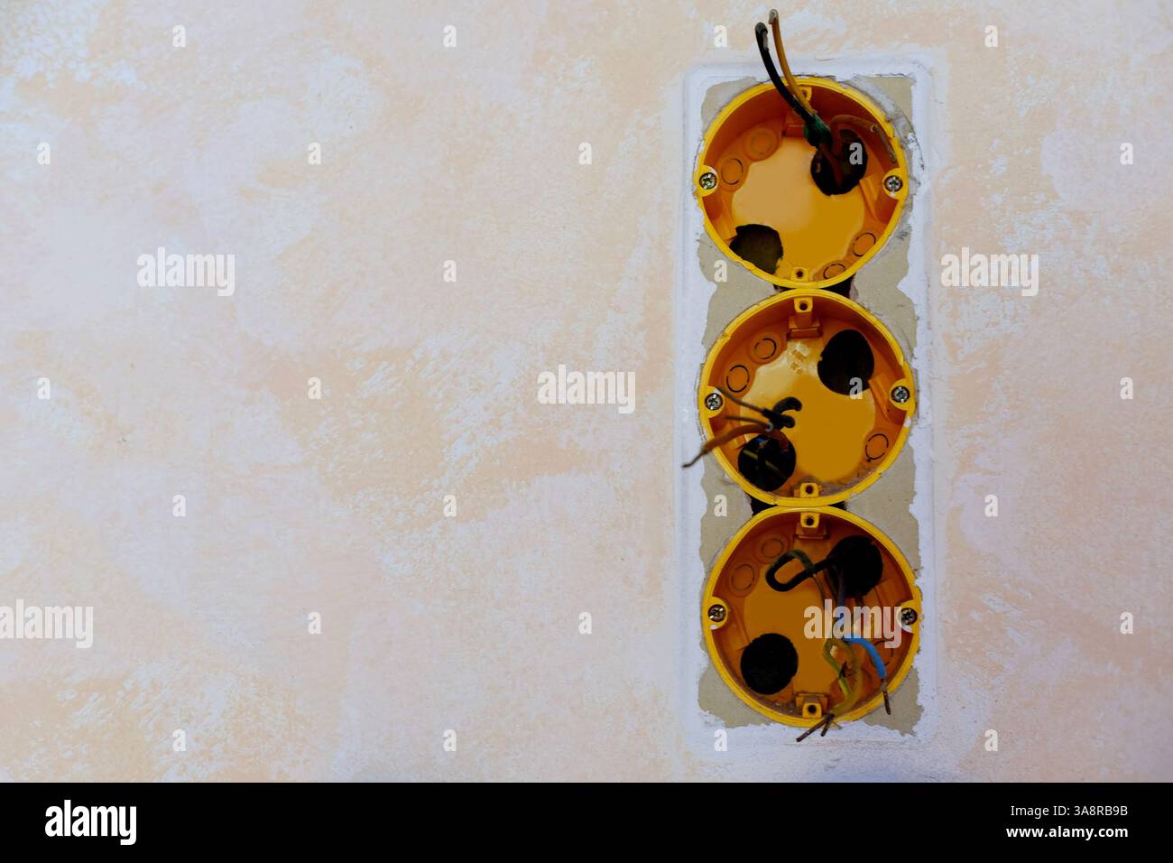 Electrical junction boxes on wall, symbolizing home renovation and ...