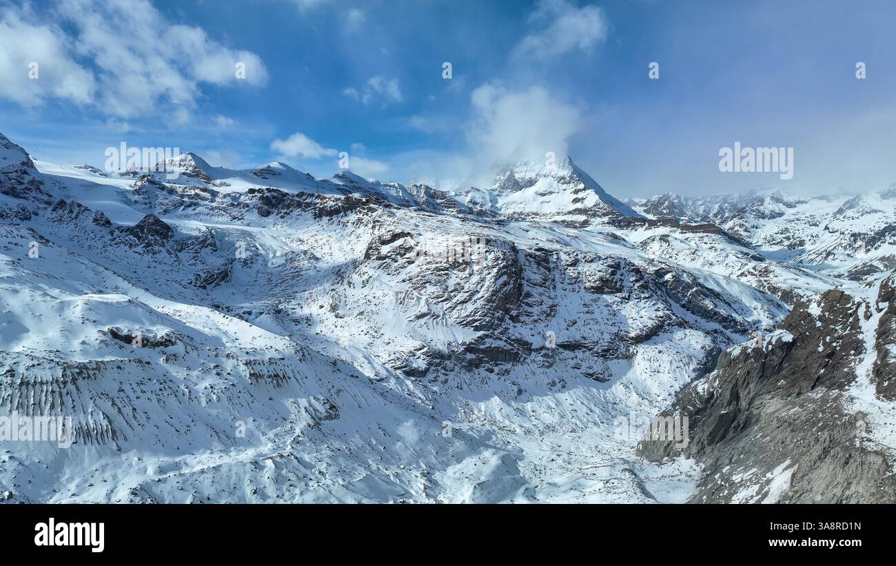 Scenic aerial view of mountain ridge Gornergrat in Pennine Alps covered ...