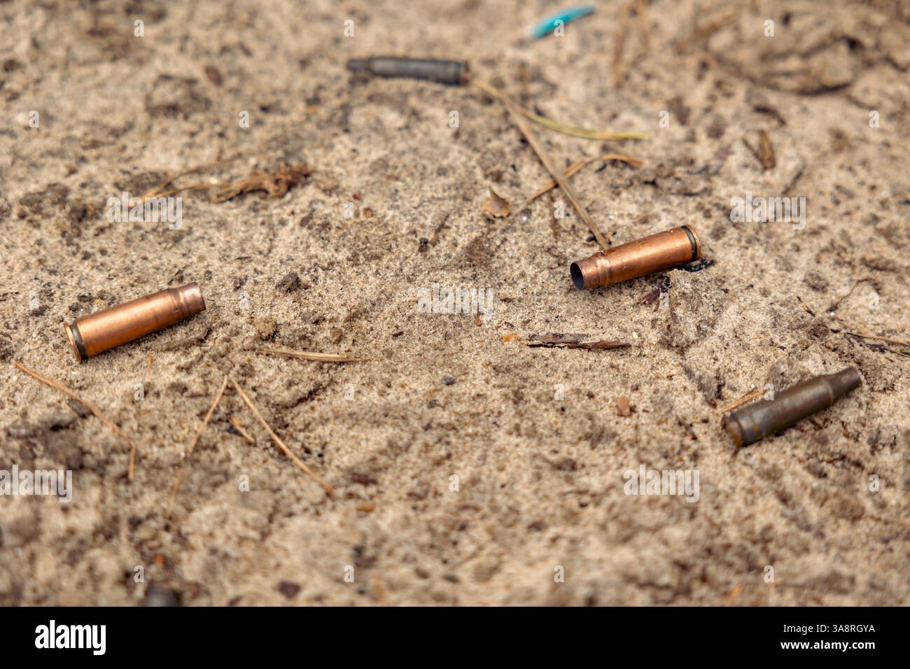 The spent cartridges scattered on the ground Stock Photo - Alamy