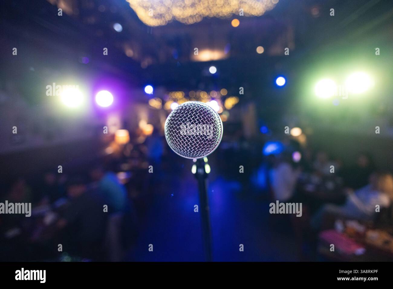 Public performance on stage Microphone on stage against a background of ...