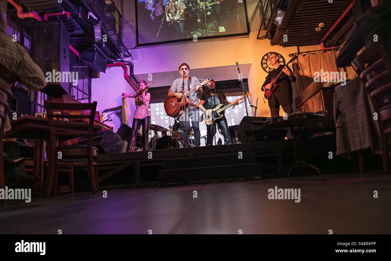 Band performs on stage, rock music concert in a nightclub Stock Photo ...