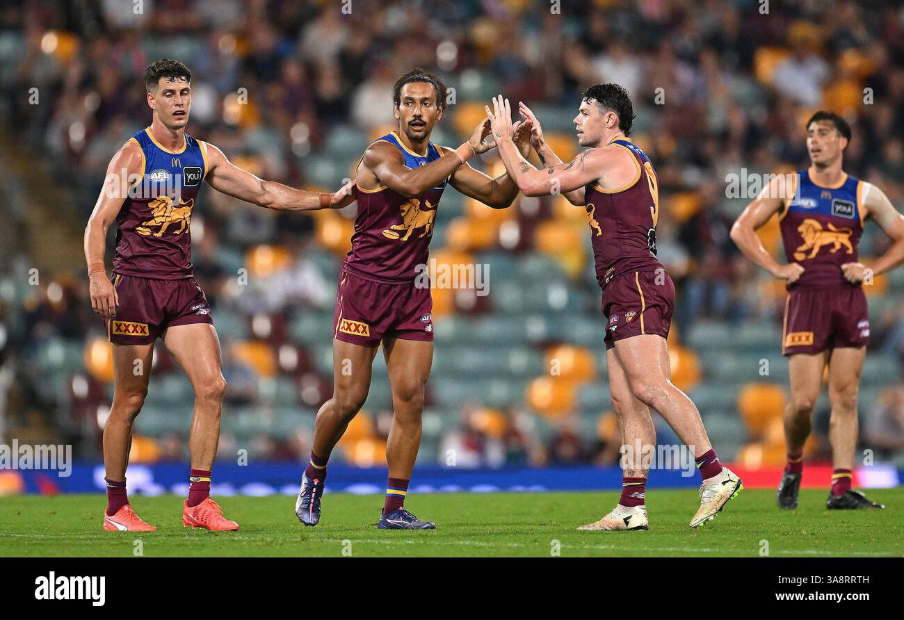 Brisbane, Australia. 29th Mar, 2025. Bruce Reville of the Lions (centre ...