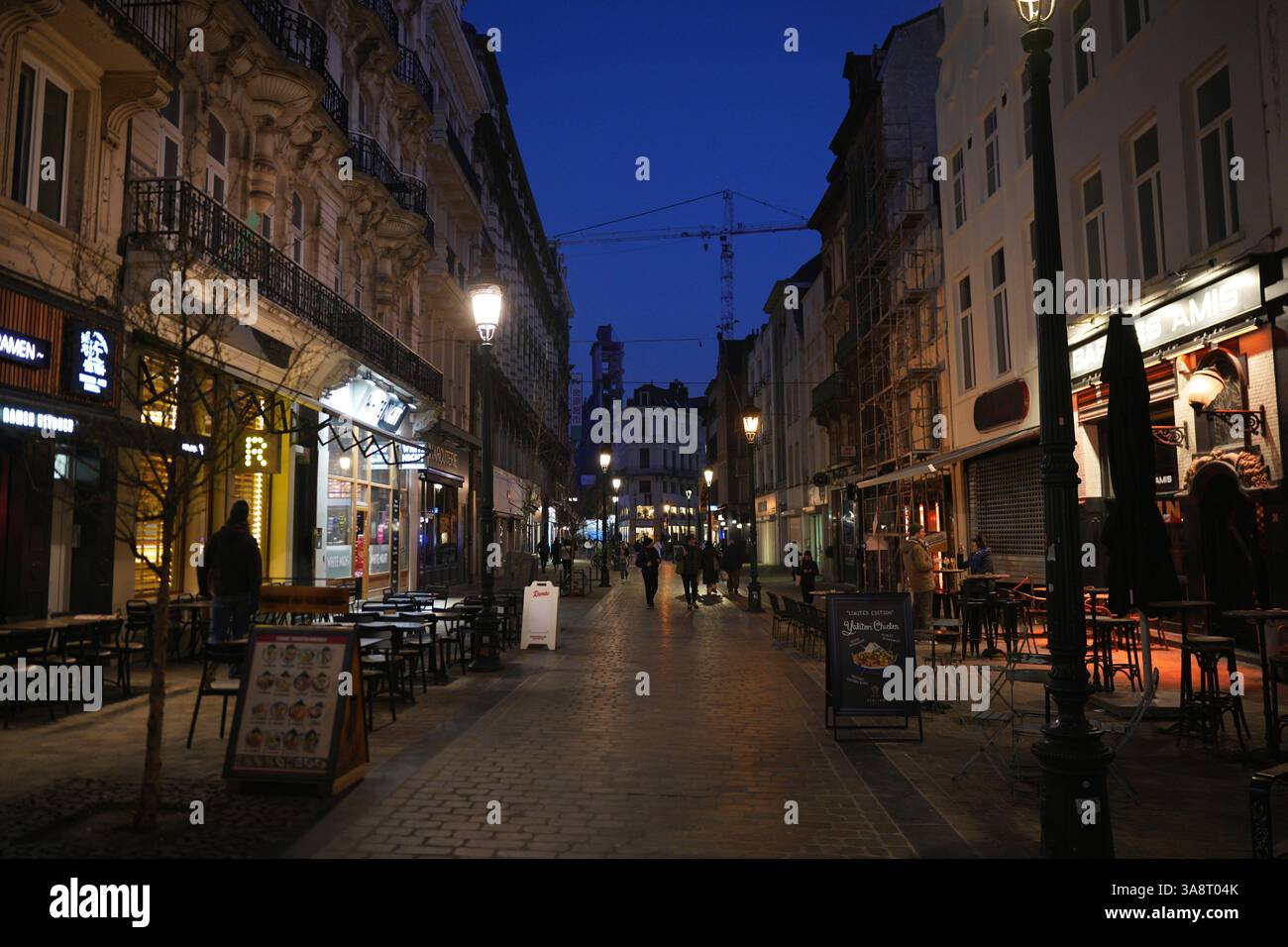 Evening street scene in Brussels Belgium 03.25.2025 Stock Photo - Alamy