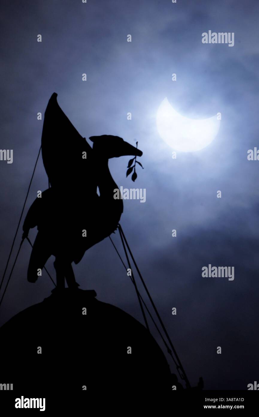 The partial solar eclipse as seen over The Royal Liver Building on ...