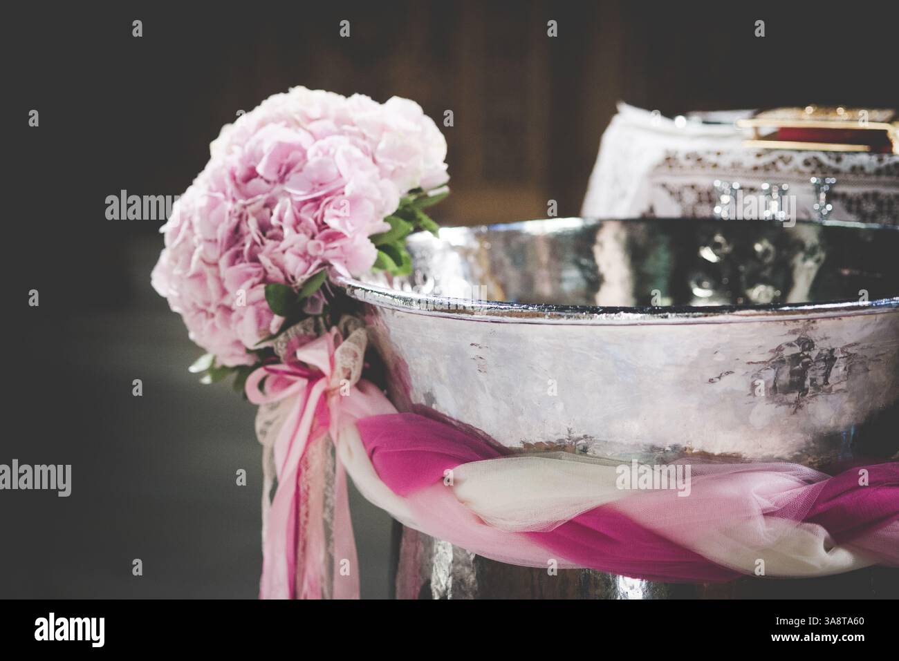The holy font inside a greek orthodox church, decorated for a girl ...