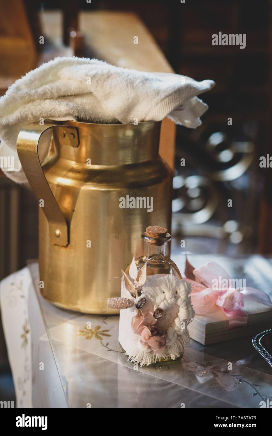Bottle of olive oil and a jug with water, during a greek orthodox ...