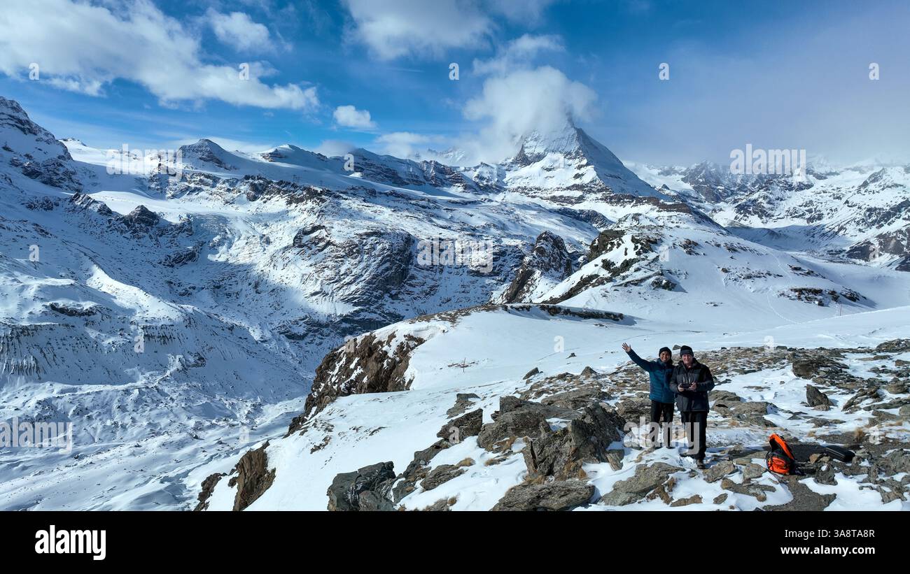 Panoramic landscape of Young asian man with his friend standing on top ...