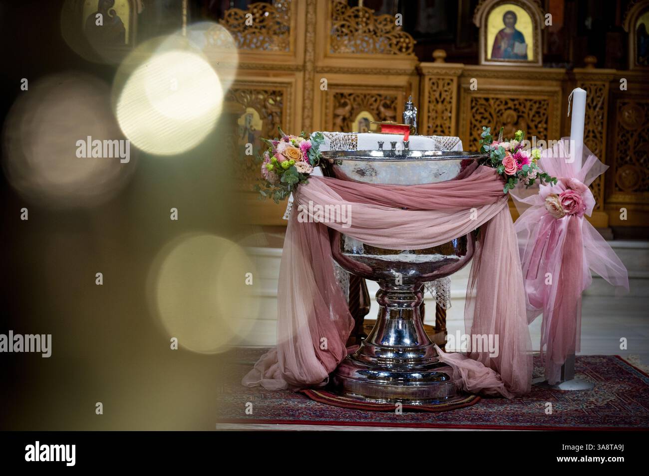 The holy font inside a greek orthodox church, decorated for a girl baptism Stock Photo - Alamy