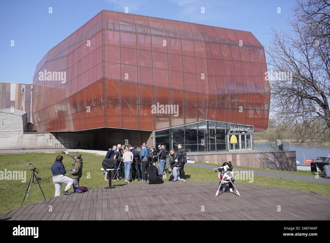 Warsaw, Poland . 29th Mar, 2025. People watch the partial solar eclipse ...