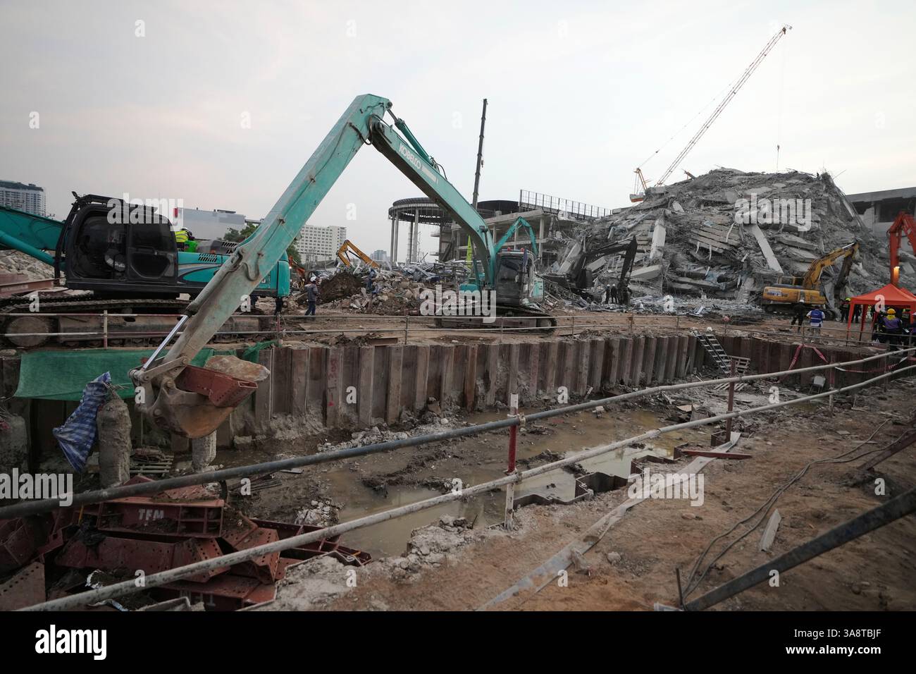A rescue work is underway at the site of an under-construction high ...