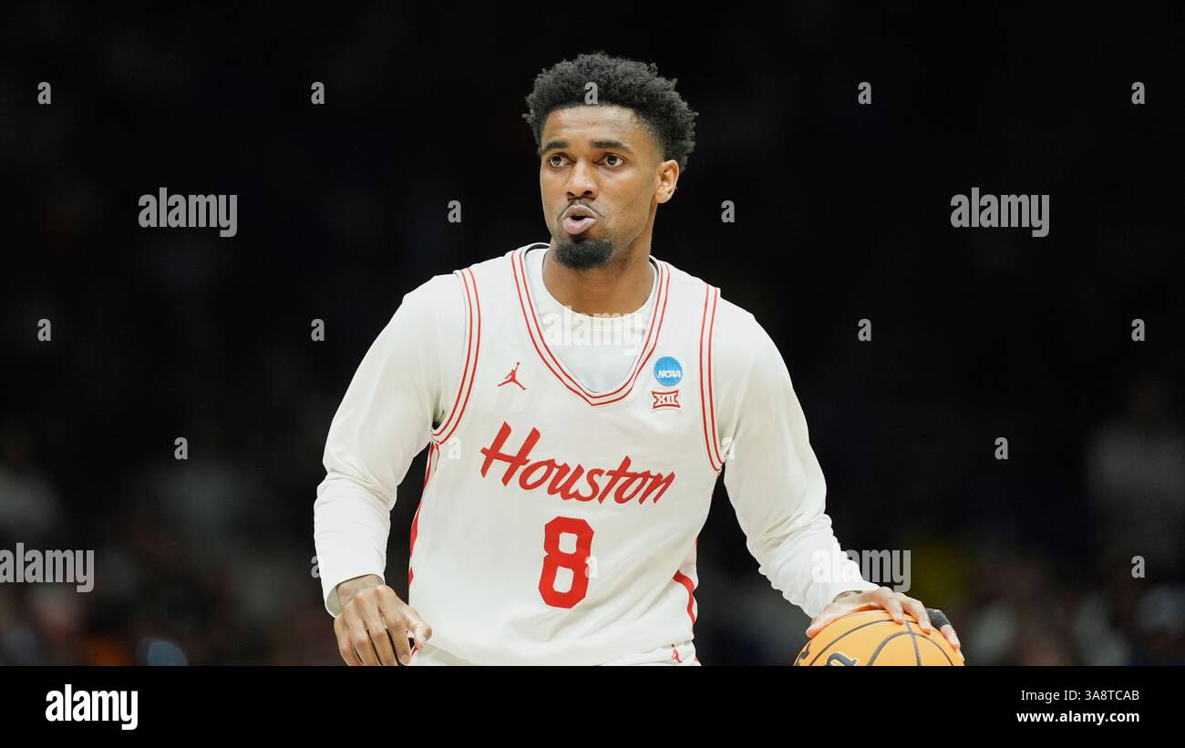 Houston's Mylik Wilson brings the ball down the court during the first ...