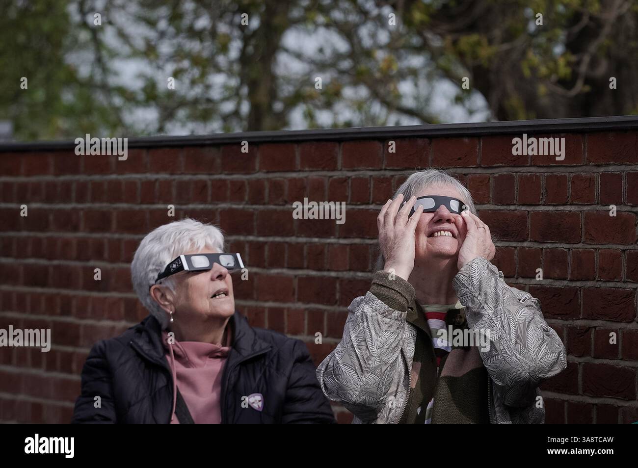 London, UK. 29th March, 2025. UK Weather: Watching the partial solar ...