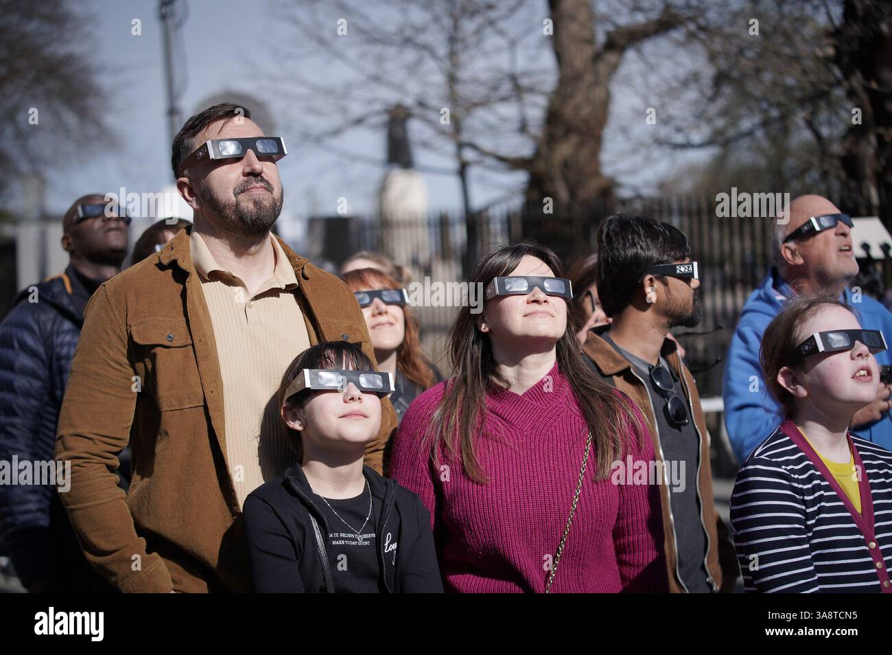 London, UK. 29th March, 2025. UK Weather: Watching the partial solar ...