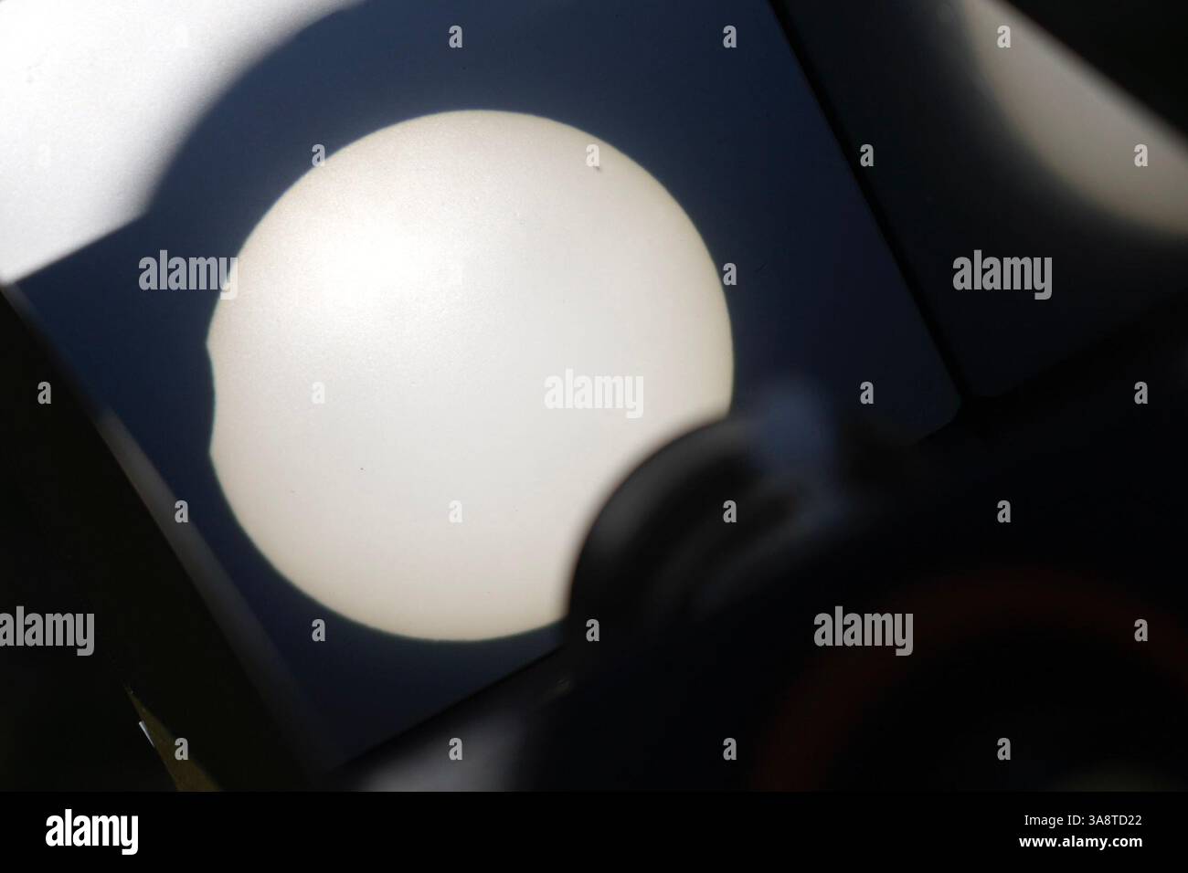 Warsaw, Poland . 29th Mar, 2025. People watch the partial solar eclipse ...