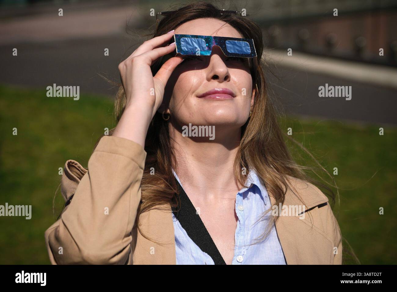 Warsaw, Poland . 29th Mar, 2025. People watch the partial solar eclipse ...