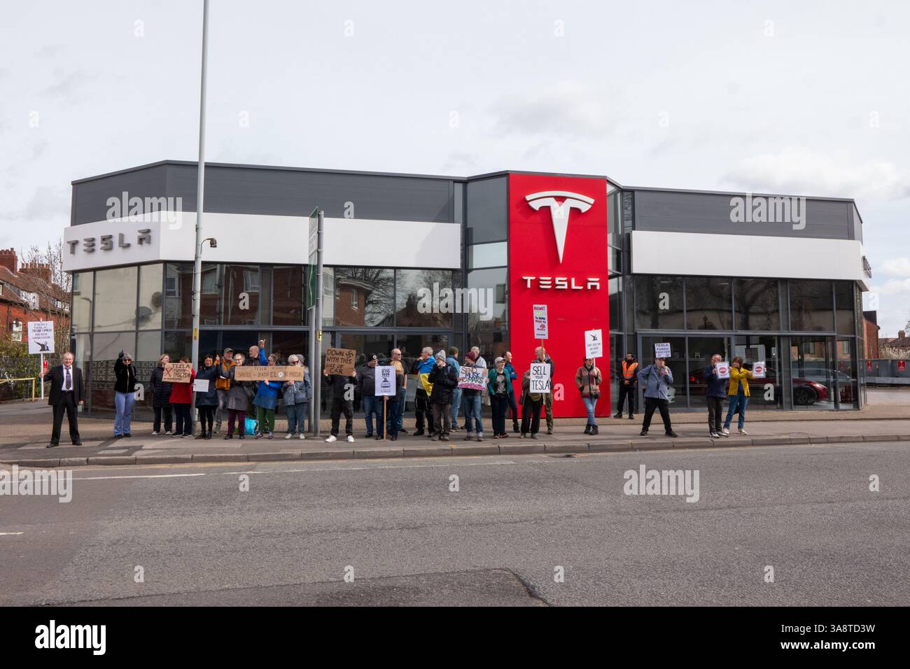 Tesla protest Manchester UK. Take down Tesla protesters outside the ...