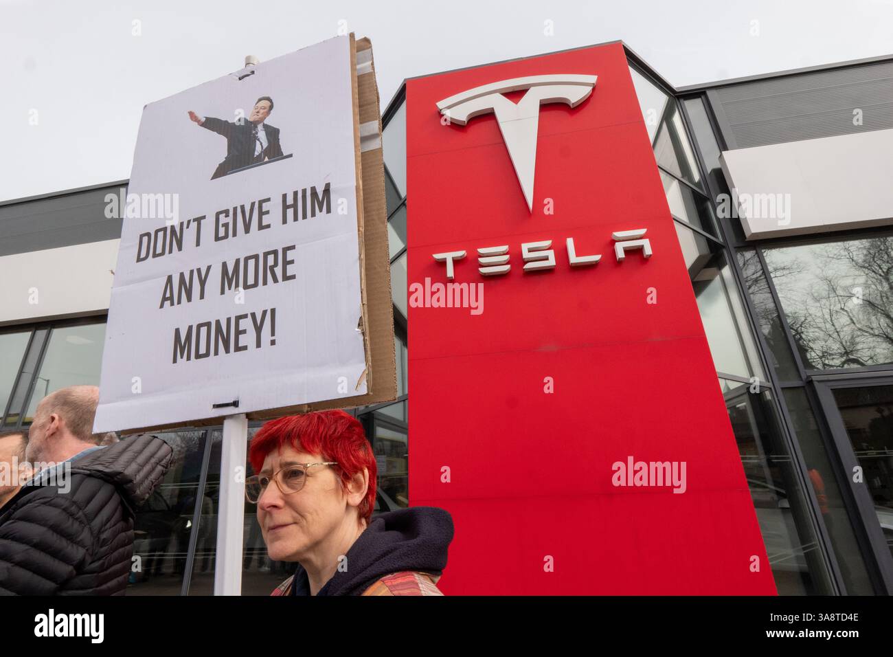 Tesla protest Manchester UK. Take down Tesla protesters outside the ...