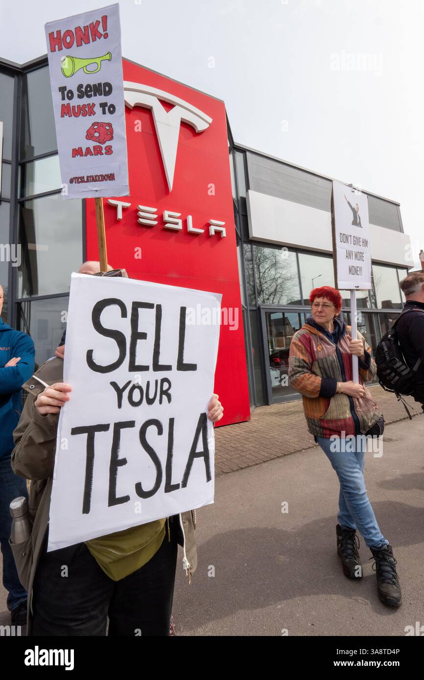 Tesla protest Manchester UK. Take down Tesla protesters outside the ...
