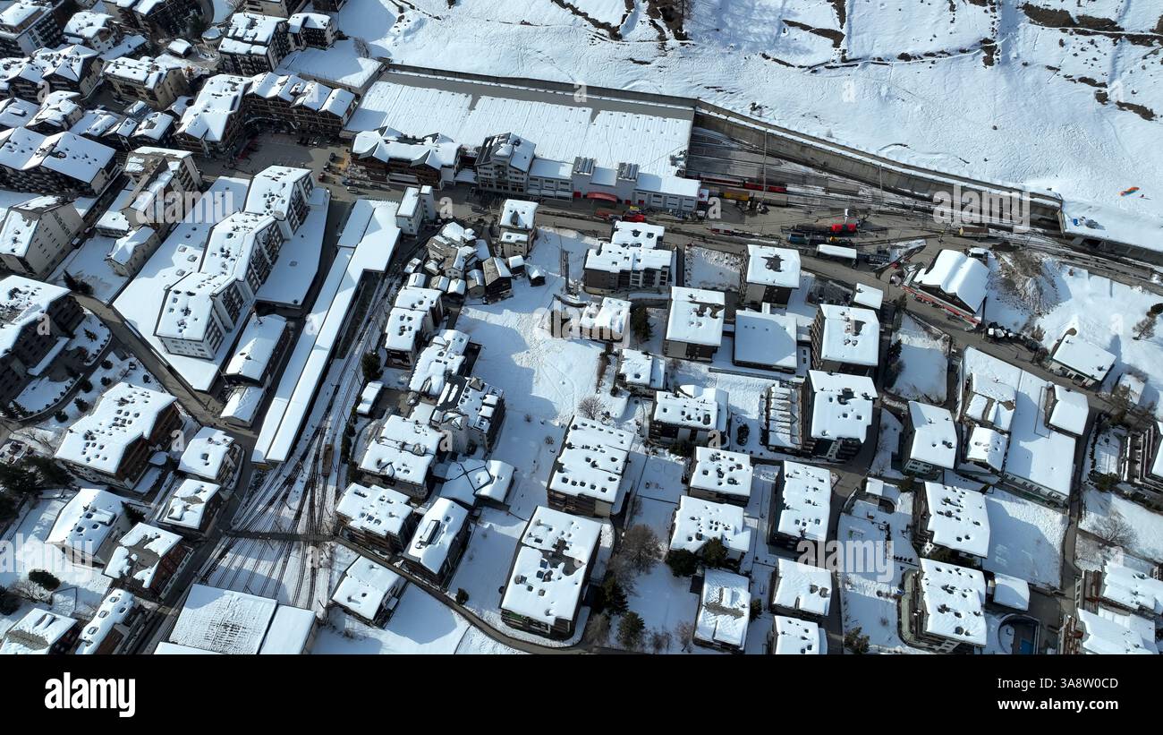 Aerial train station in Zermatt town. Drone panoramic view in the ...