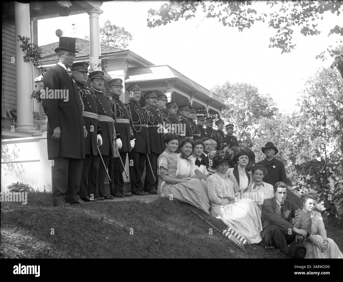 Governor Eberhardt is pictured with military officers and civilians ...