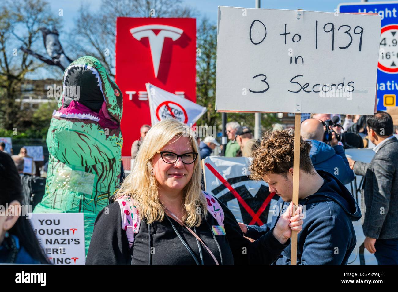 London, UK. 29th Mar, 2025. 0 to 1939 in 3 seconds placard and a man in ...