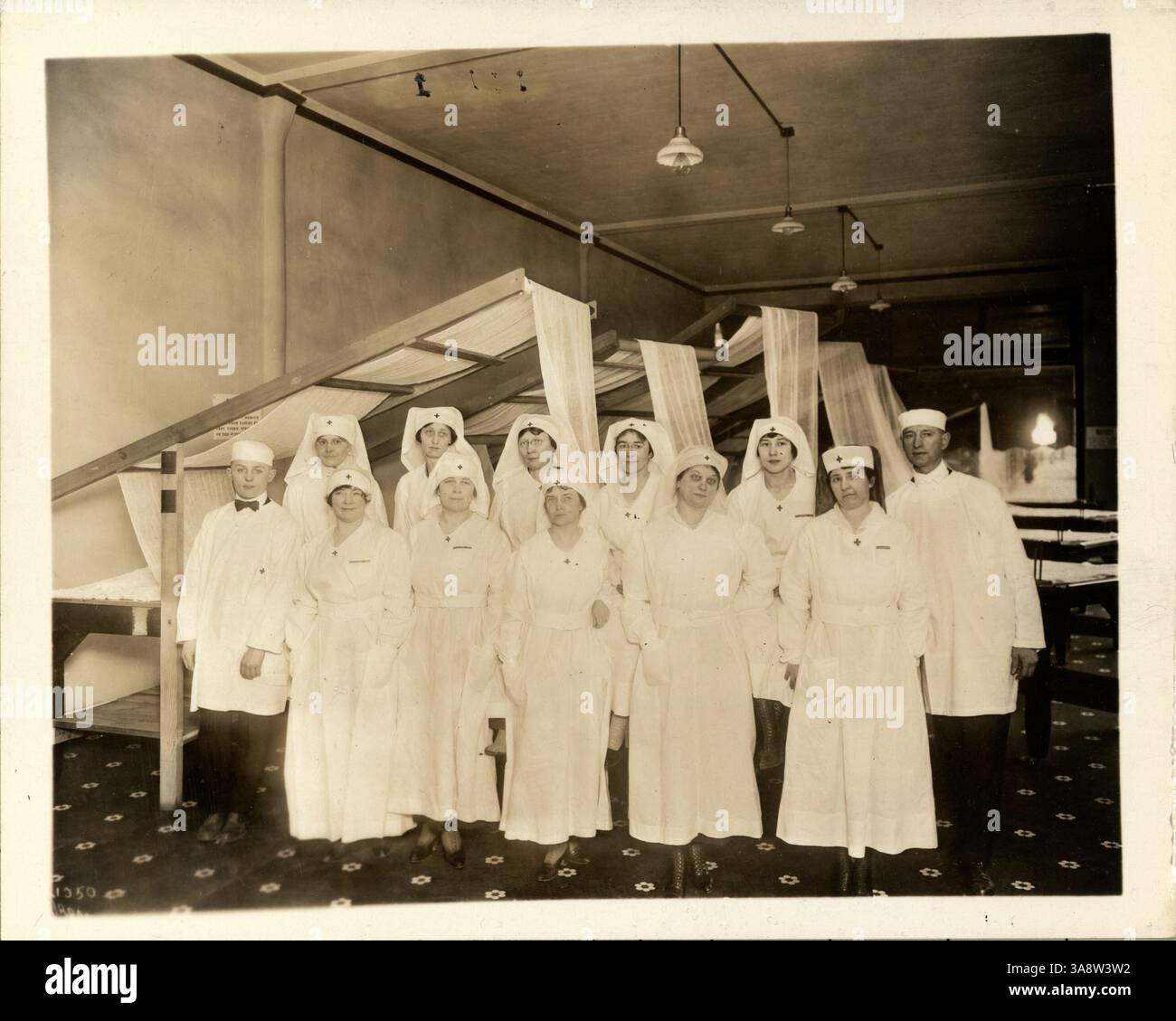 A historical photograph showing Red Cross workers posing in their ...