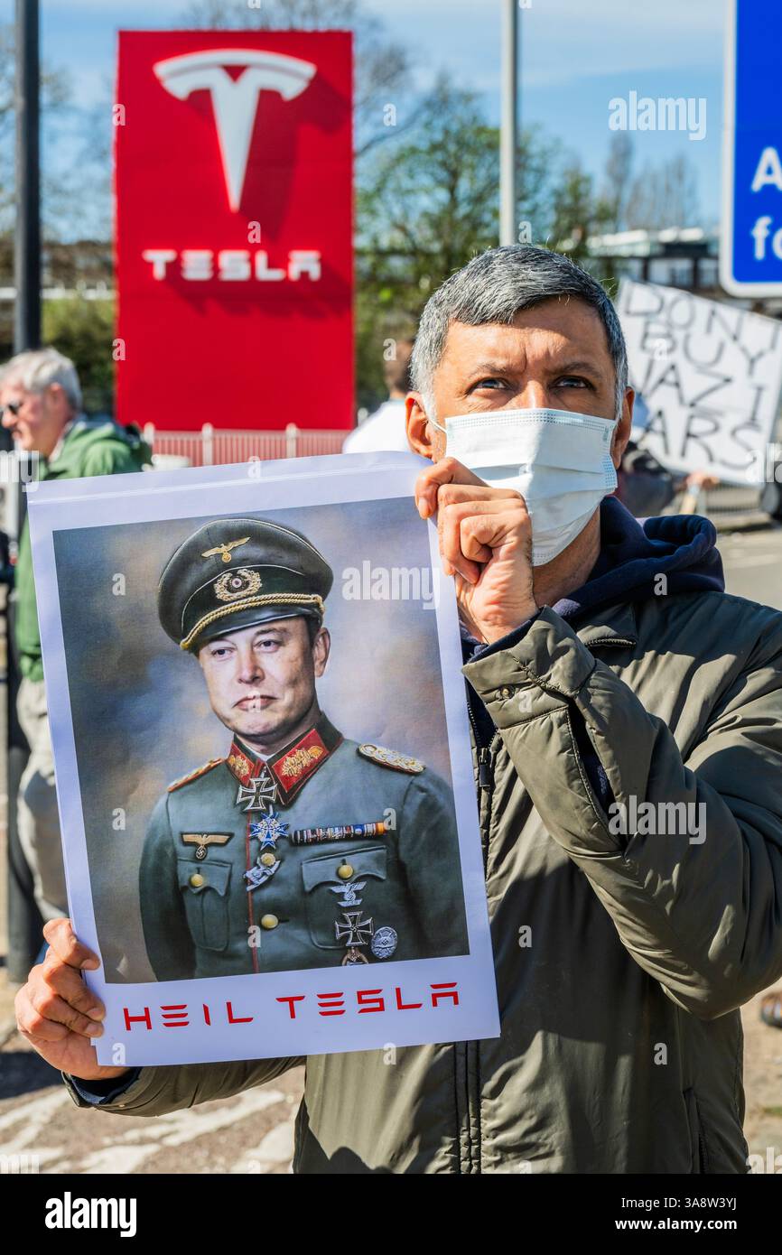 London, UK. 29 Mar 2025. Heil Tesla and Dont fund Facism placards - Say ...