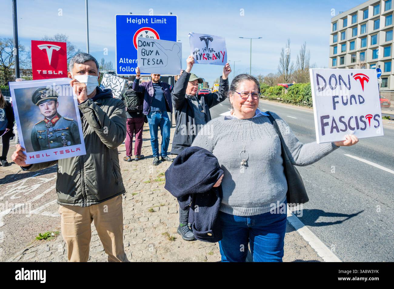 London, UK. 29 Mar 2025. Heil Tesla and Dont fund Facism placards - Say ...