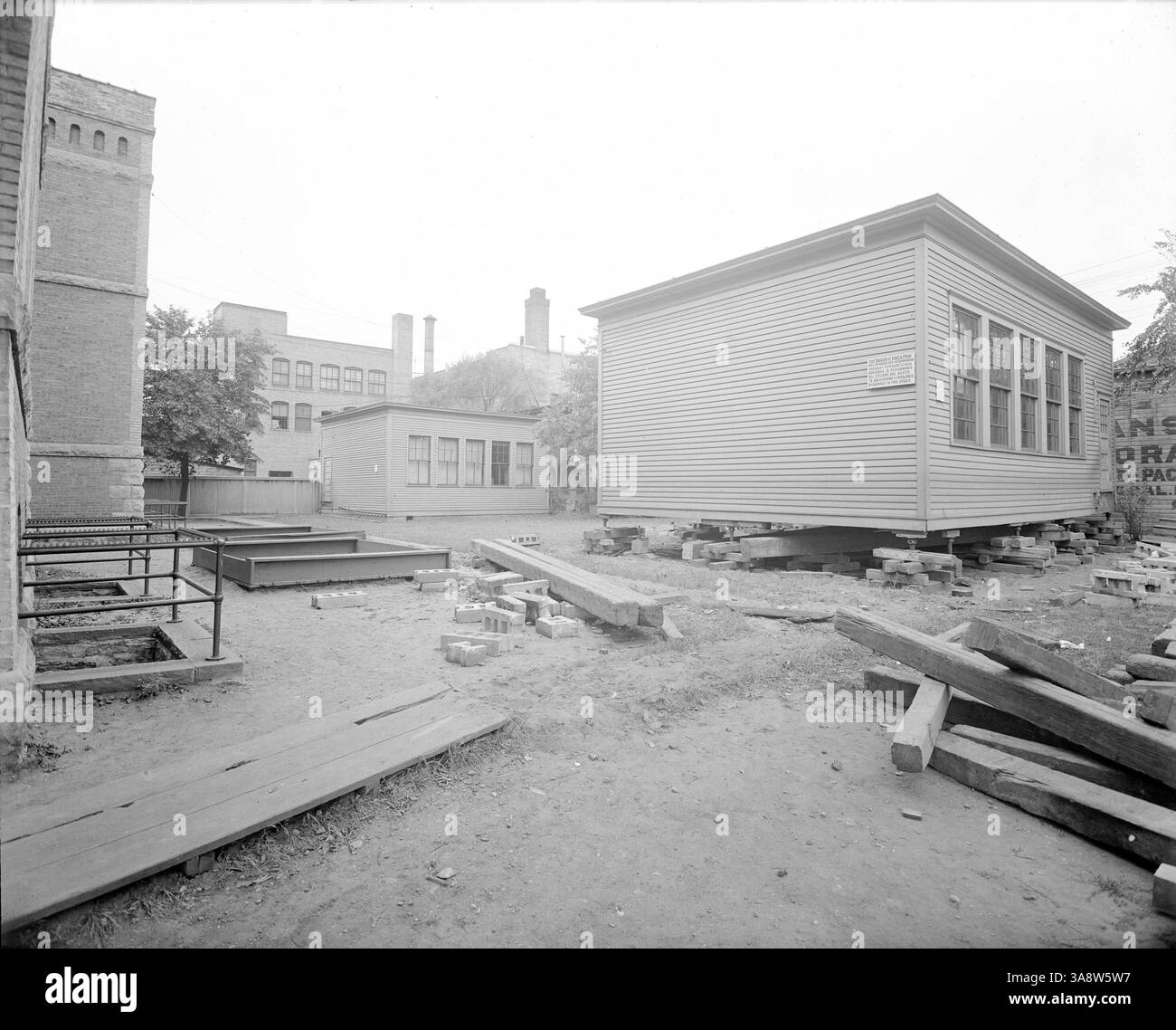 A portable building is set up on jacks at Calhoun School, highlighting ...