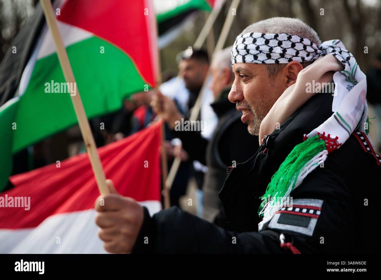 Berlin, Germany. 29th Mar, 2025. A participant holds a Palestinian at ...