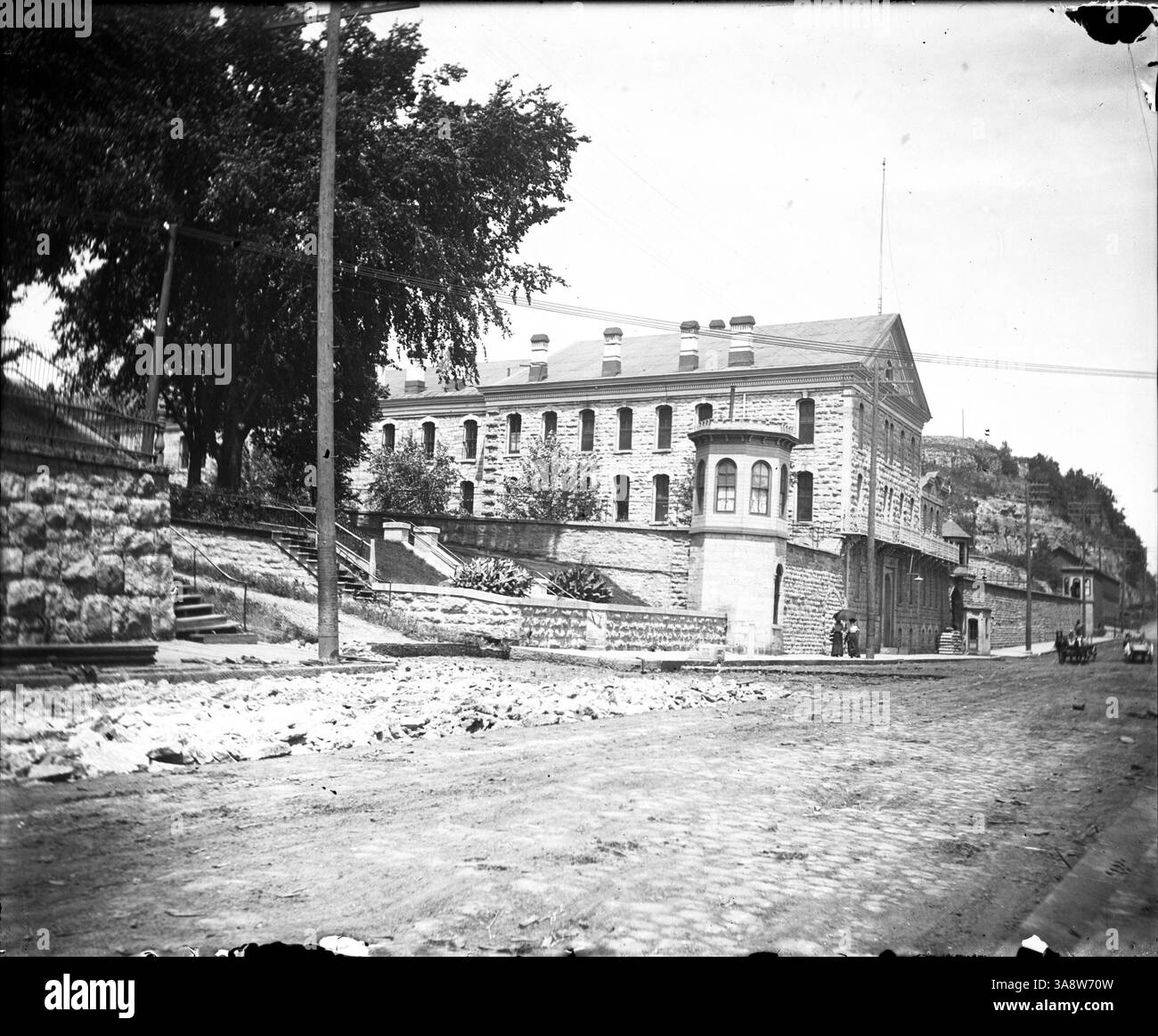 This image shows two women walking past the front entrance of the ...