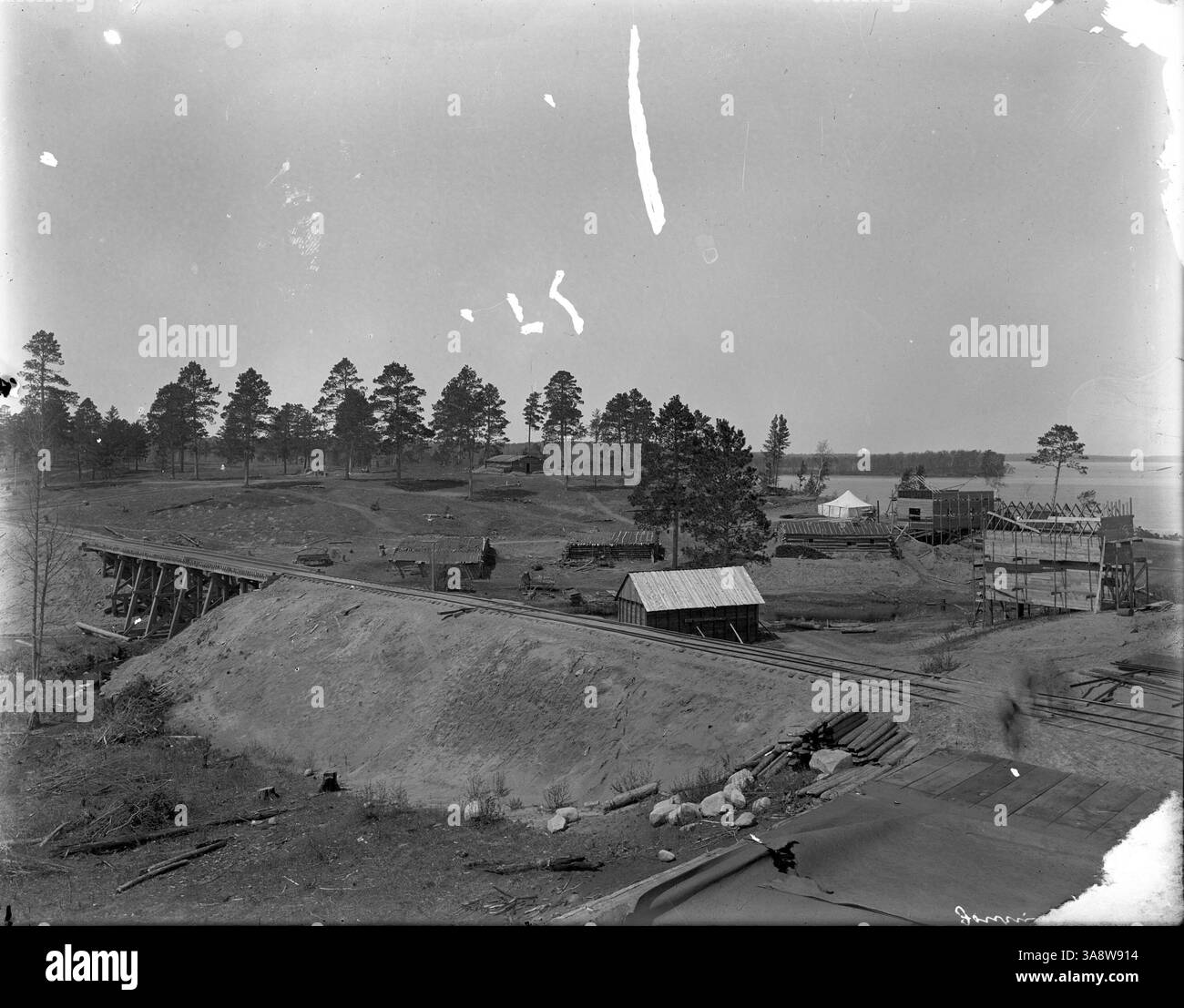 Buildings under construction behind lake hi-res stock photography and ...