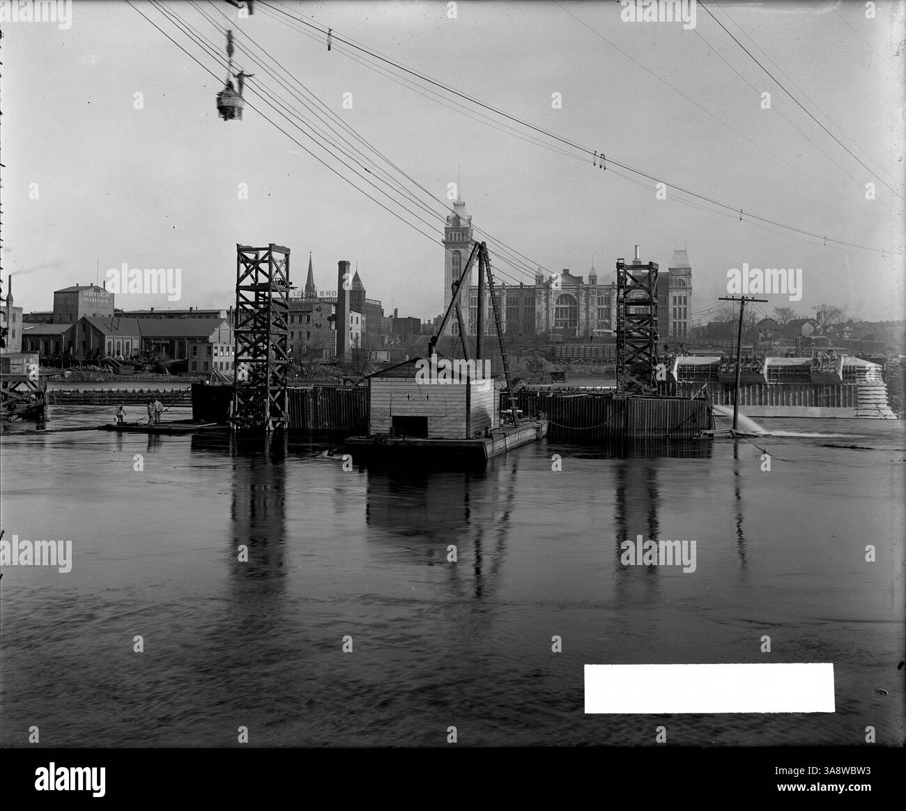A photo documenting the process of unwatering the cofferdam at Pier #3 ...